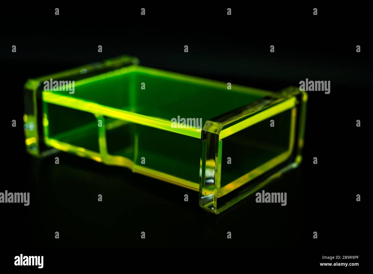 abstract green transparent plastic box dark background Stock Photo - Alamy