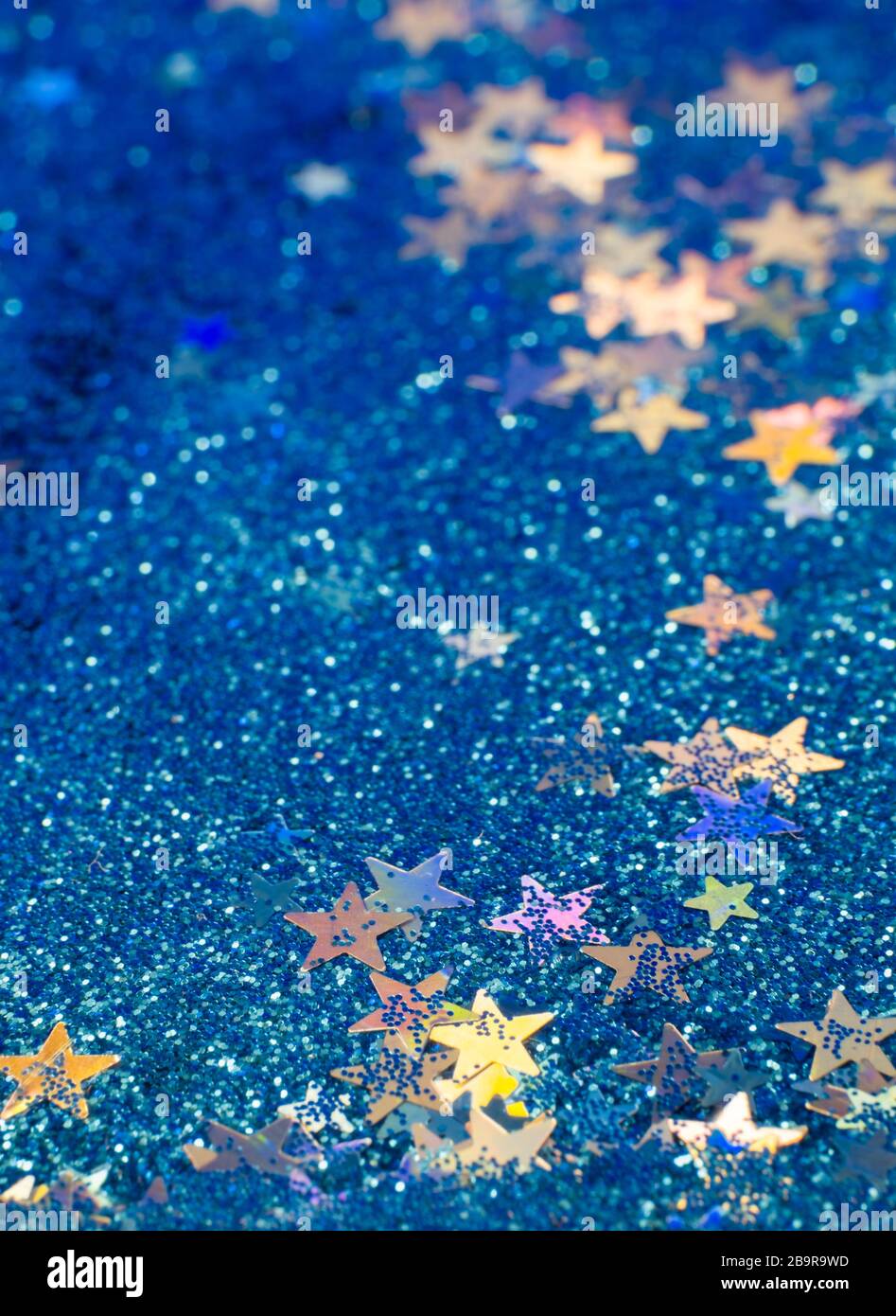 blue sparkles and multicolour stars background Stock Photo - Alamy