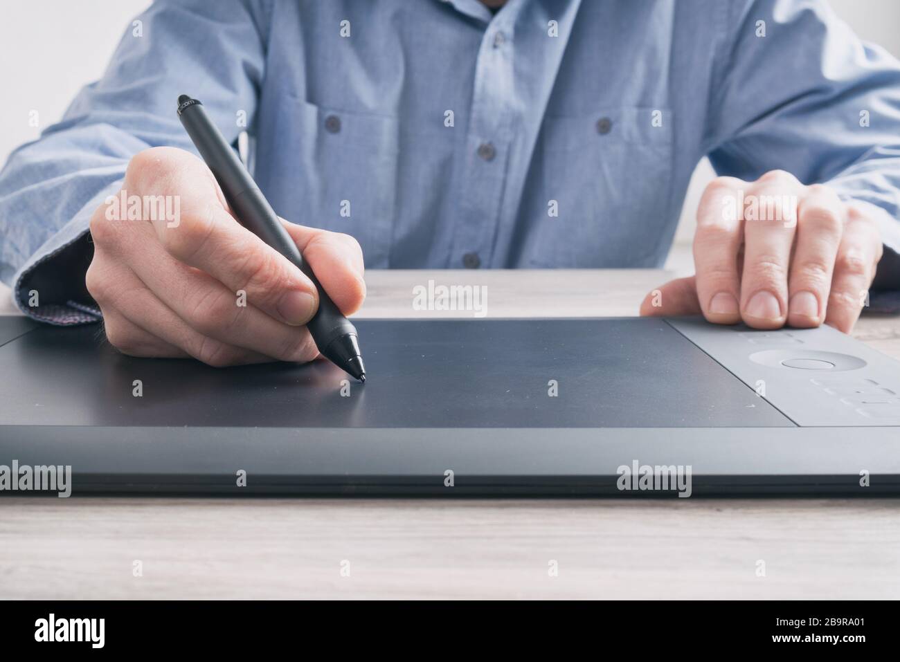 Man using computer graphics tablet hi-res stock photography and images ...