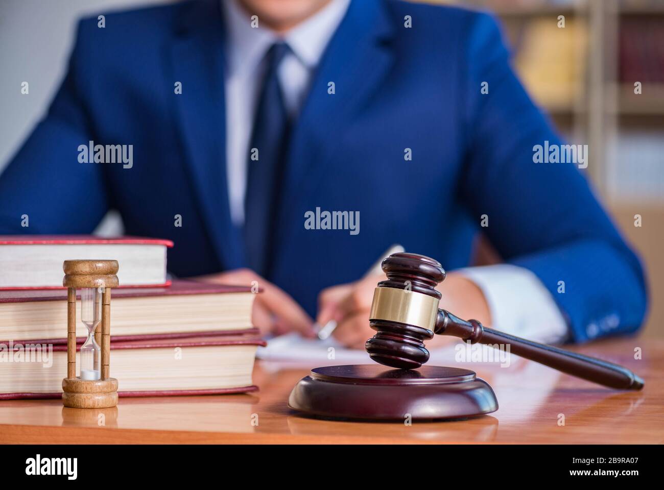 The handsome judge with gavel sitting in courtroom Stock Photo - Alamy