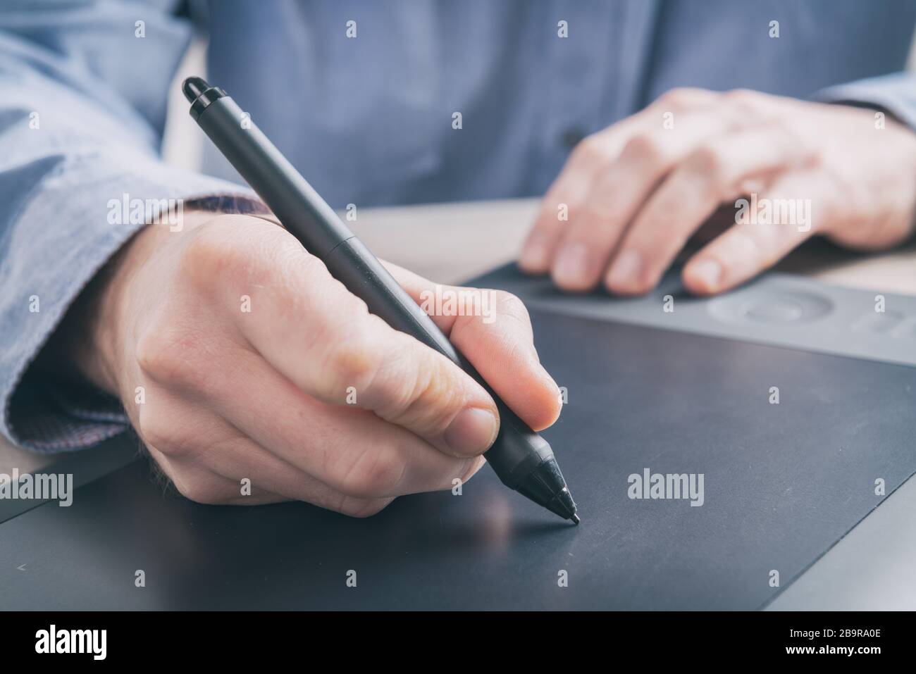Man using computer graphics tablet hi-res stock photography and images ...