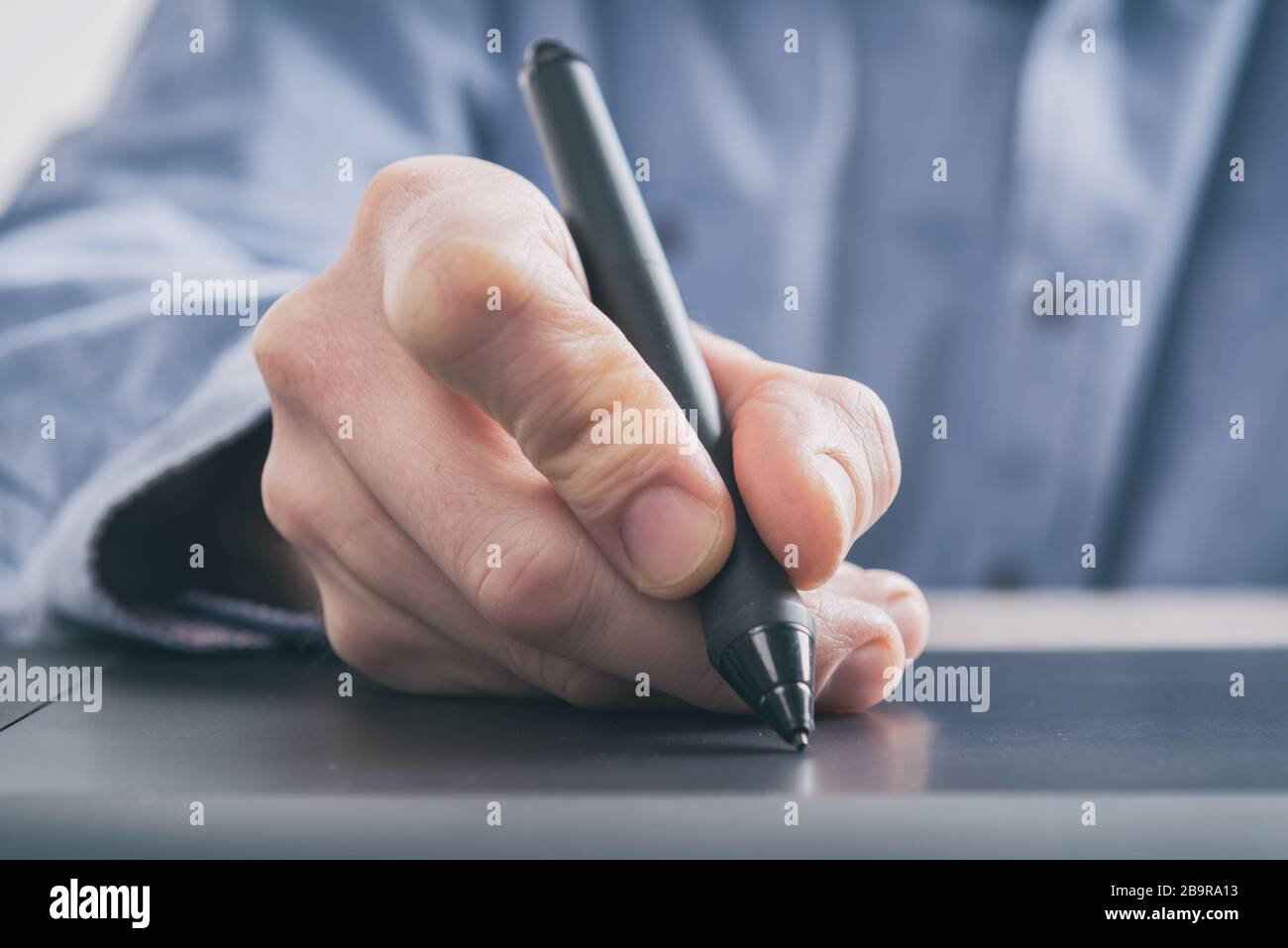 Man using computer graphics tablet hi-res stock photography and images ...