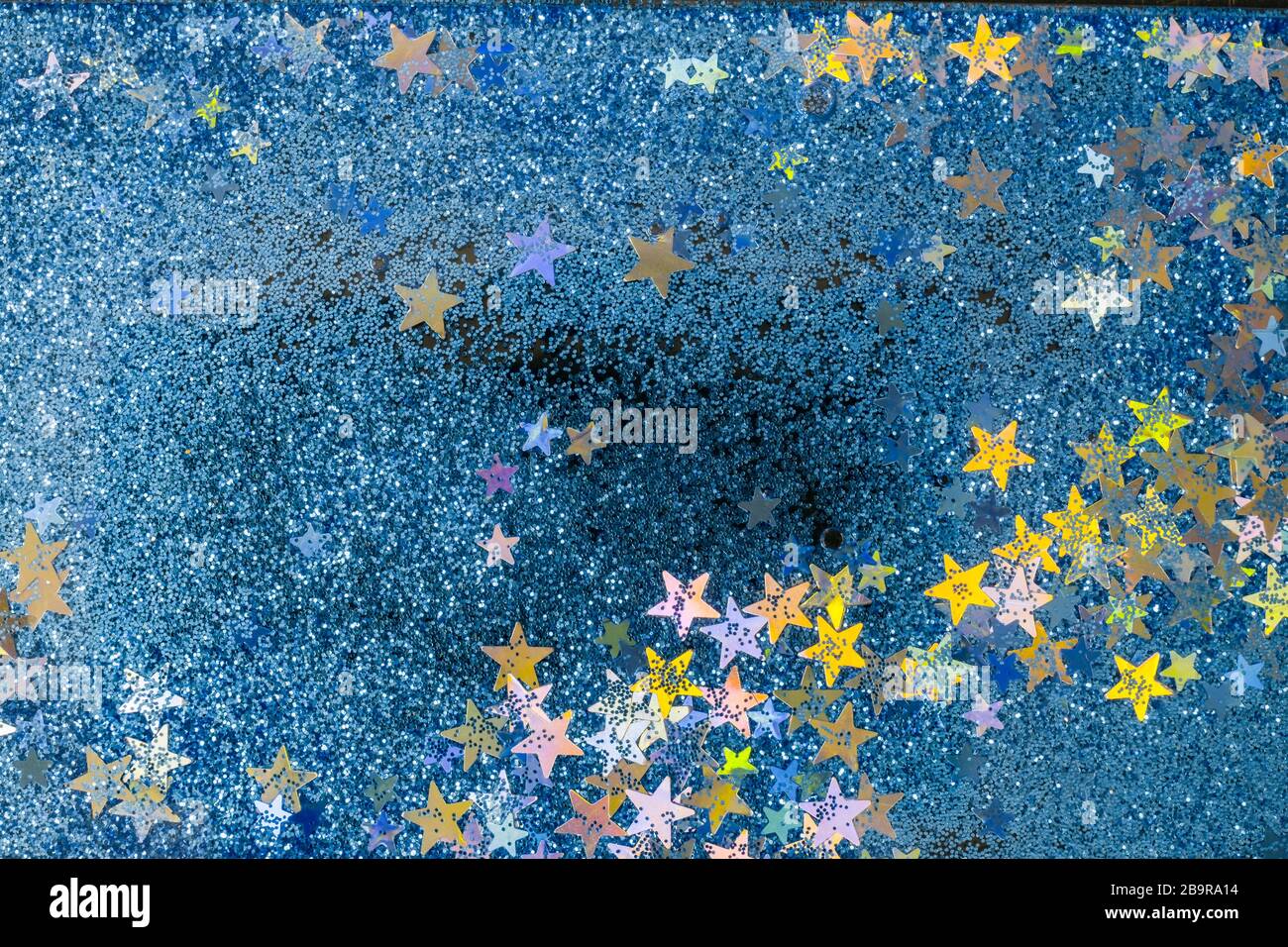blue sparkles and multicolour stars background Stock Photo - Alamy