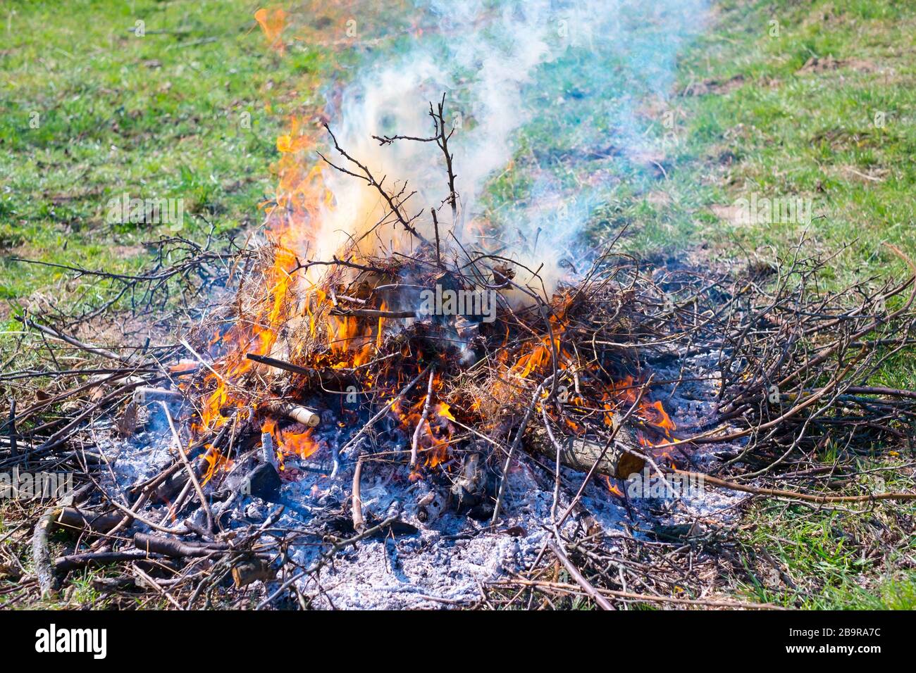Fire and Smoke from during Burning of garden branches Stock Photo - Alamy