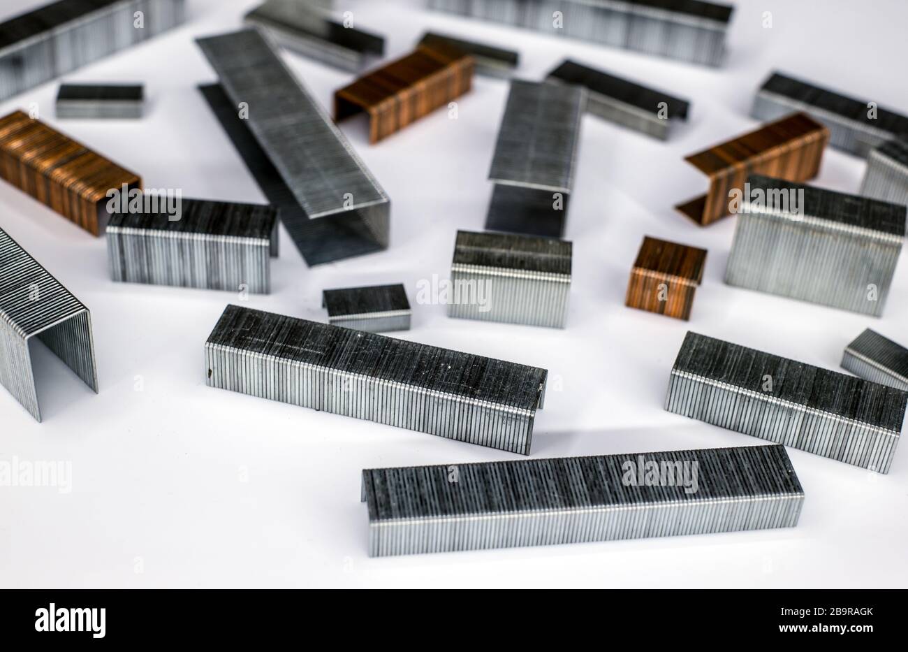 Metal staples for stapler on white background Stock Photo - Alamy