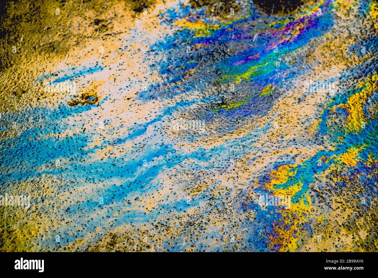 Oil stain on Asphalt road after rain, color Gasoline fuel spots on ...