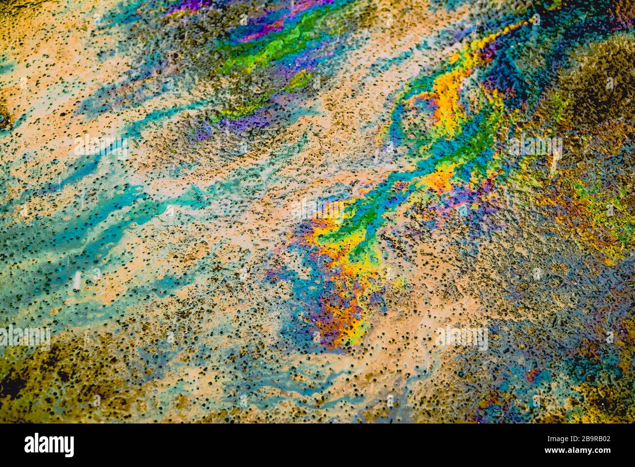 Oil stain on Asphalt road after rain, color Gasoline fuel spots on ...