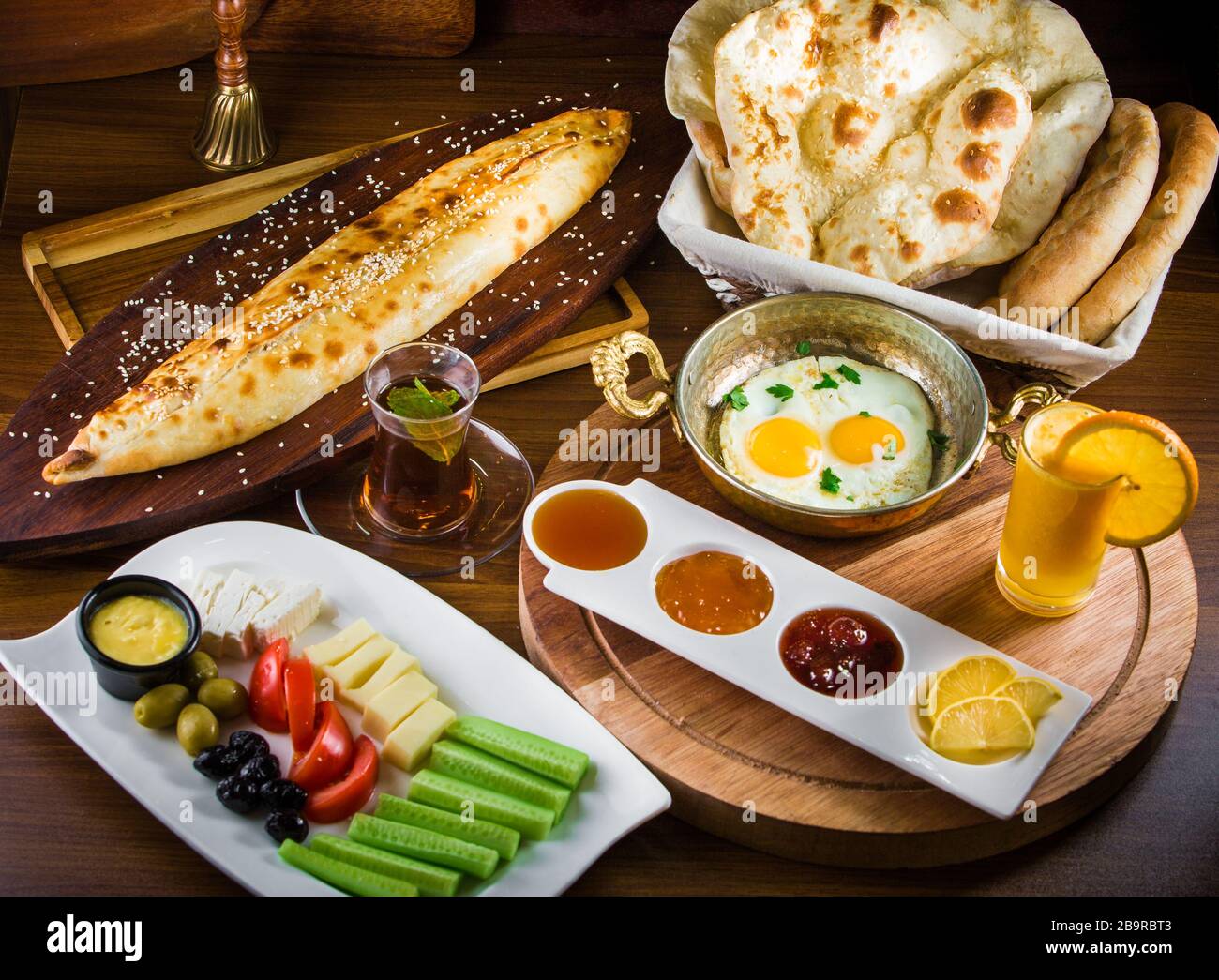 Traditional Turkish Breakfast with sesame bagel and fry egg with ...