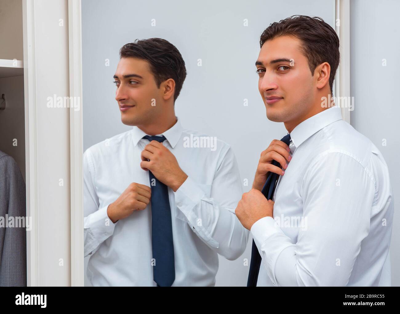 The businessman dressing up for work Stock Photo - Alamy