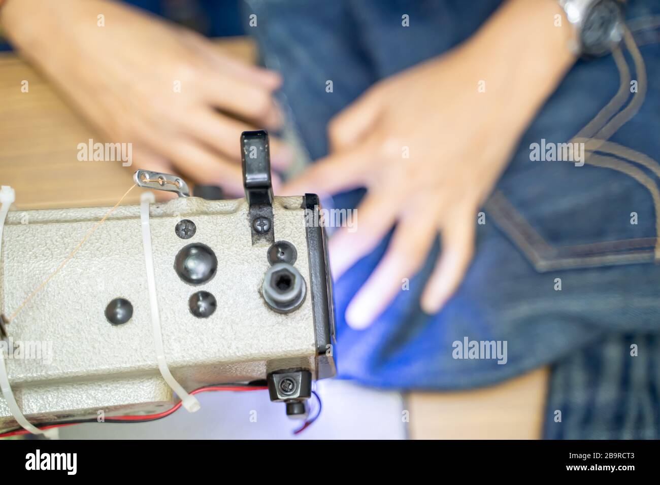 hands working on the sewing machine Stock Photo - Alamy