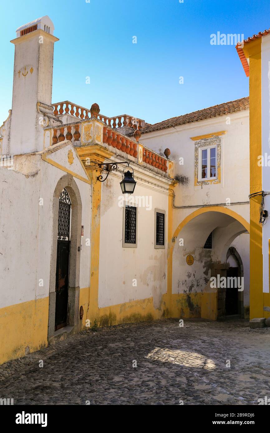 Evora, typical yellow and white Portuguese buildings, Portugal Stock ...