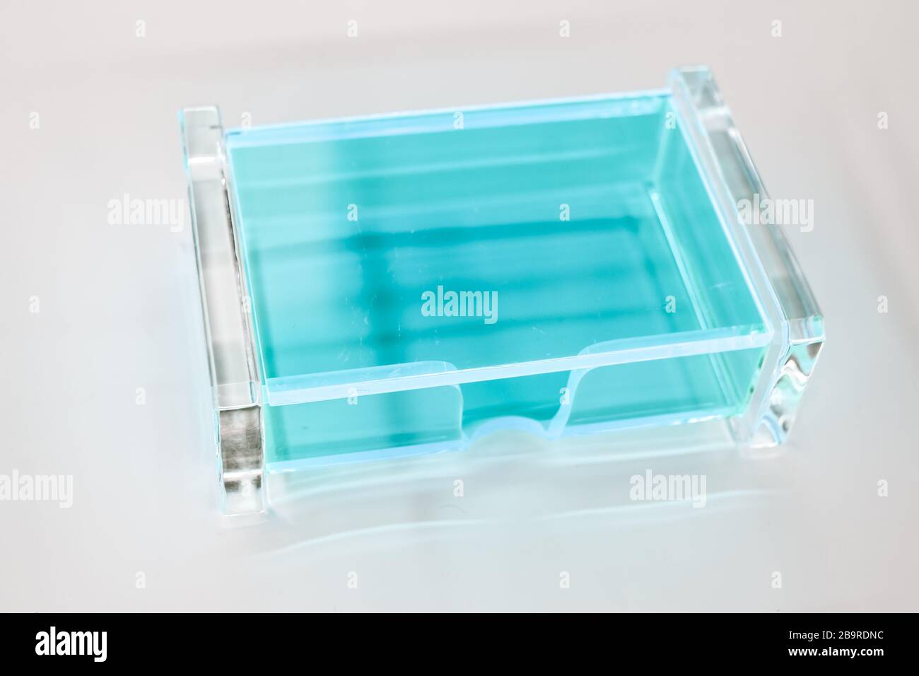 transparent blue plastic box on white background Stock Photo - Alamy
