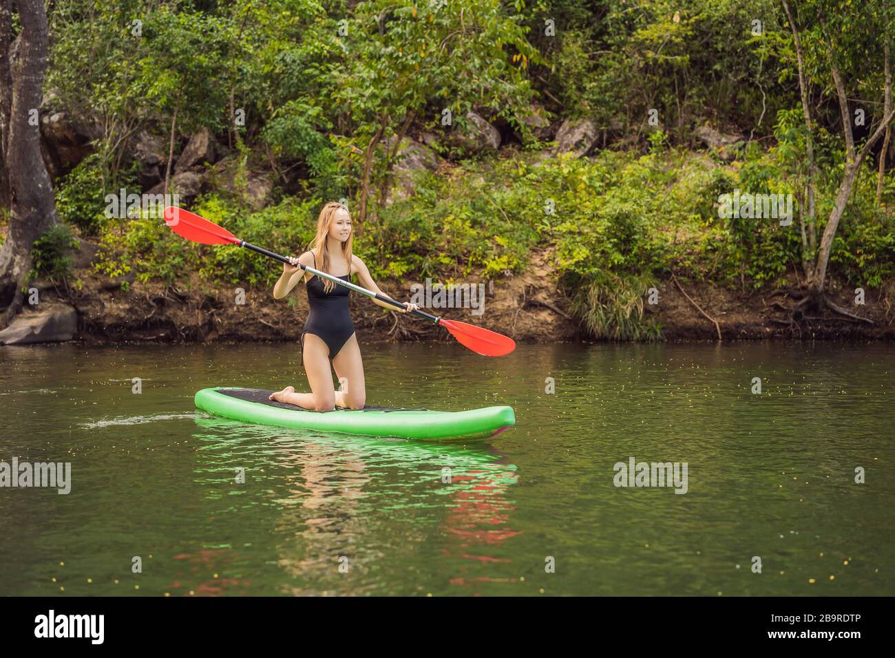 Yoga Meditation On Paddleboard At Sunset High Resolution Stock ...
