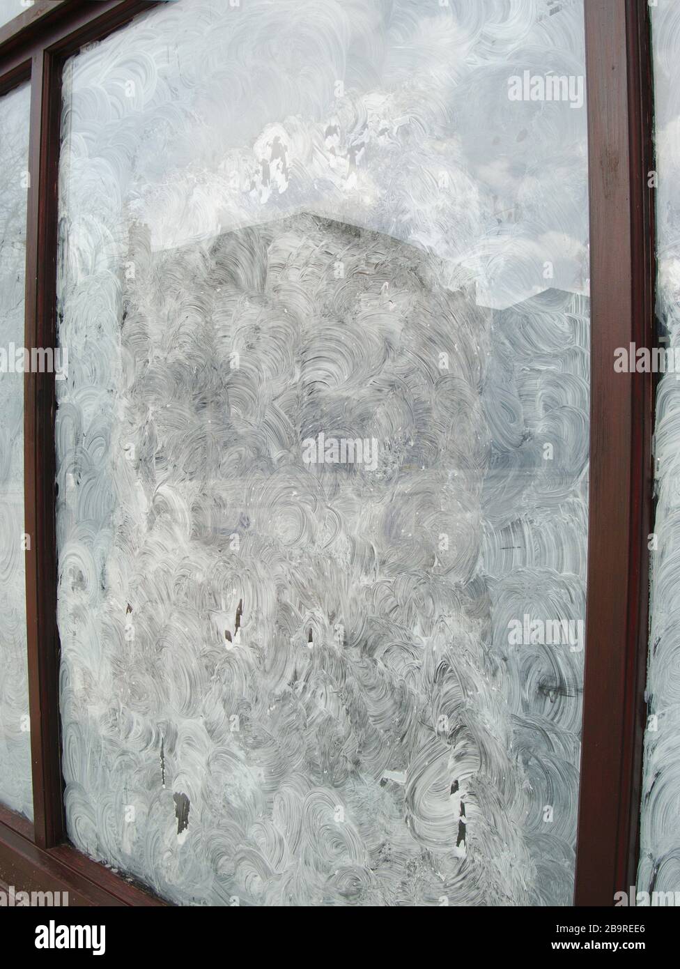 whitewashed shop windows of closed high street retail business Stock ...