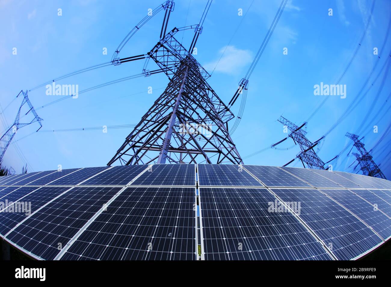Pylon and photovoltaic panels in the evening Stock Photo - Alamy