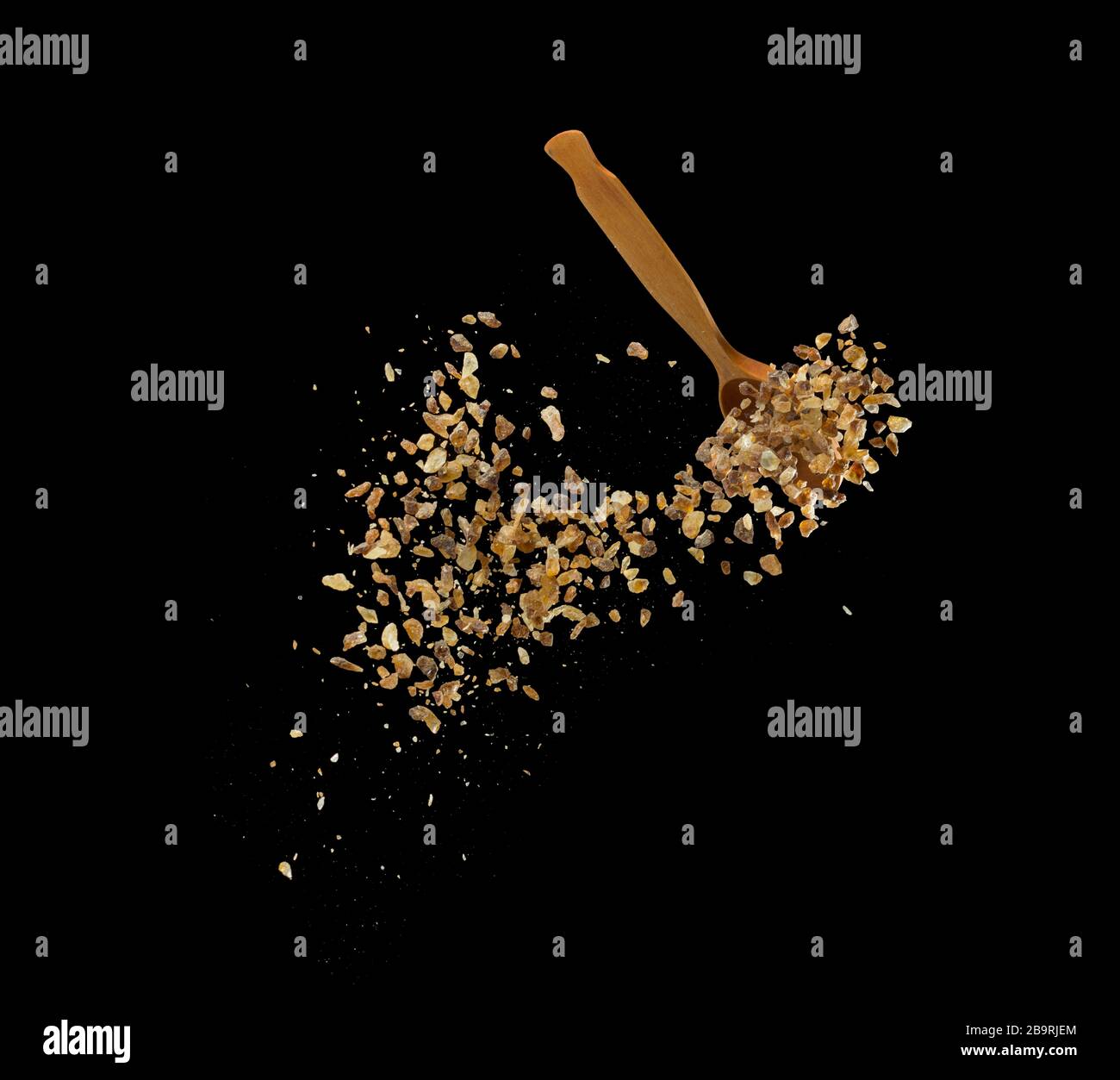 Brown sugar explosion with spoon, close up. Zero gravity concept Stock ...