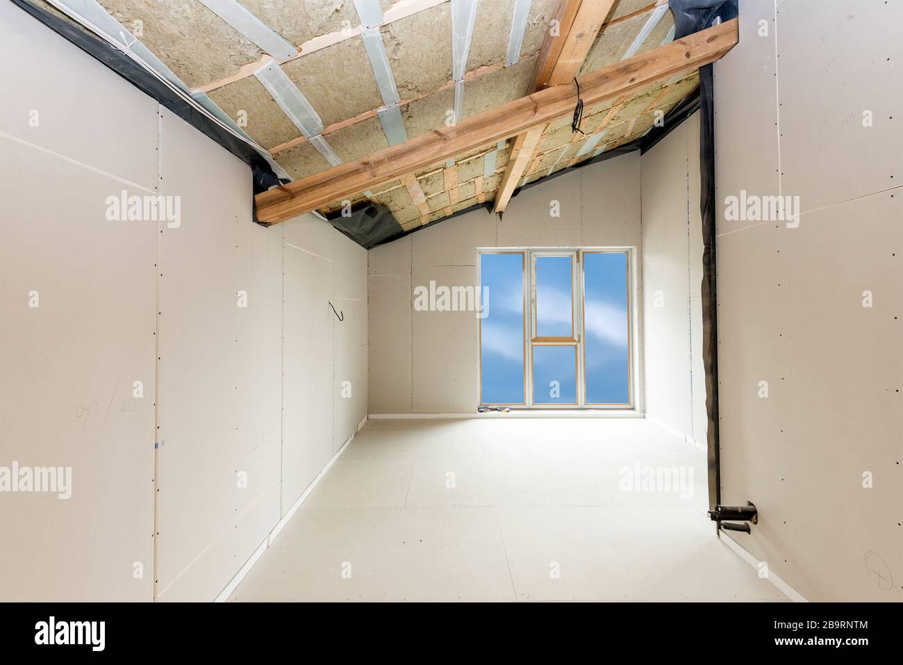 Rroom under construction with gypsum plaster boards. Roofing ...