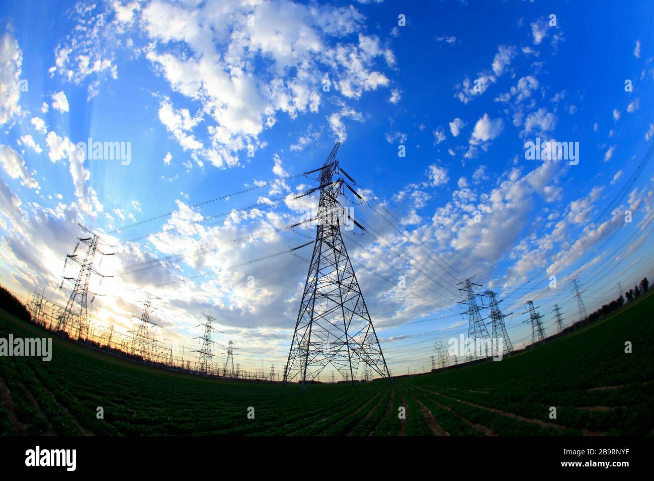 Pylon, the pylon under the blue sky white clouds Stock Photo - Alamy