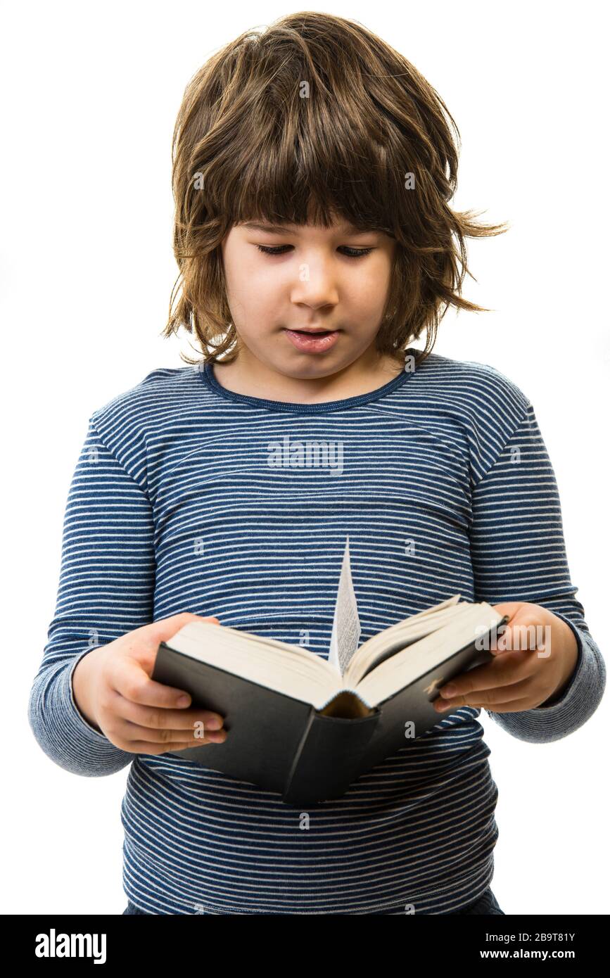 Cute boy reading bible isolated on white background Stock Photo - Alamy