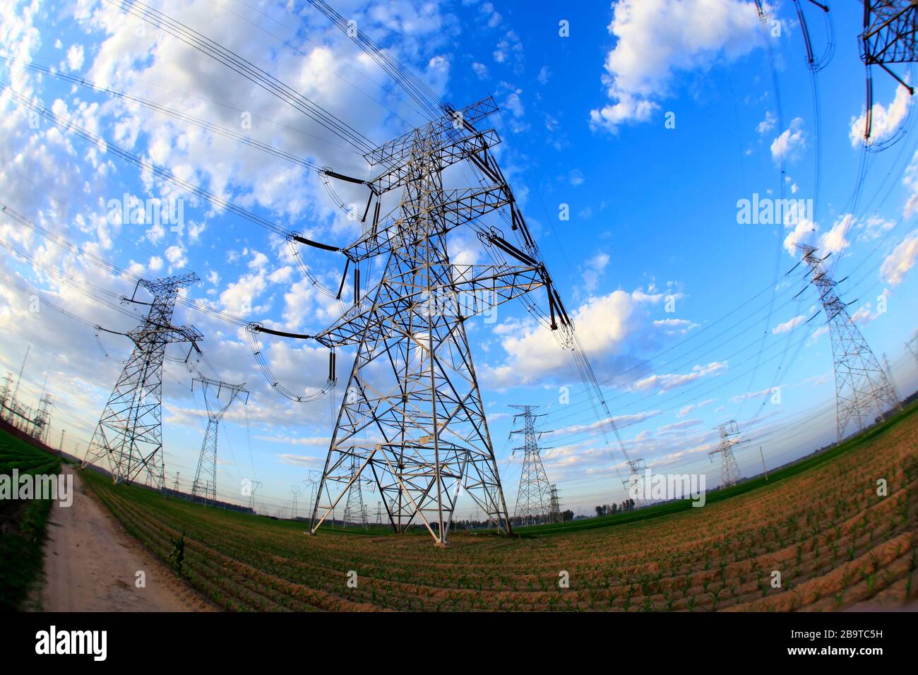 Pylon, the pylon under the blue sky white clouds Stock Photo - Alamy