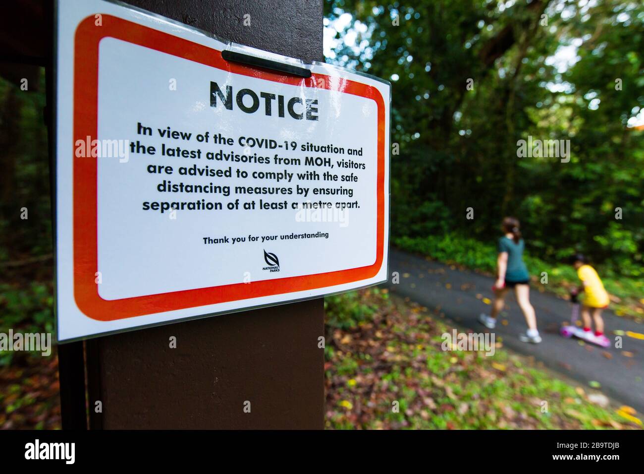 A notice sign to remind the public of the COVID-19 situation and ...