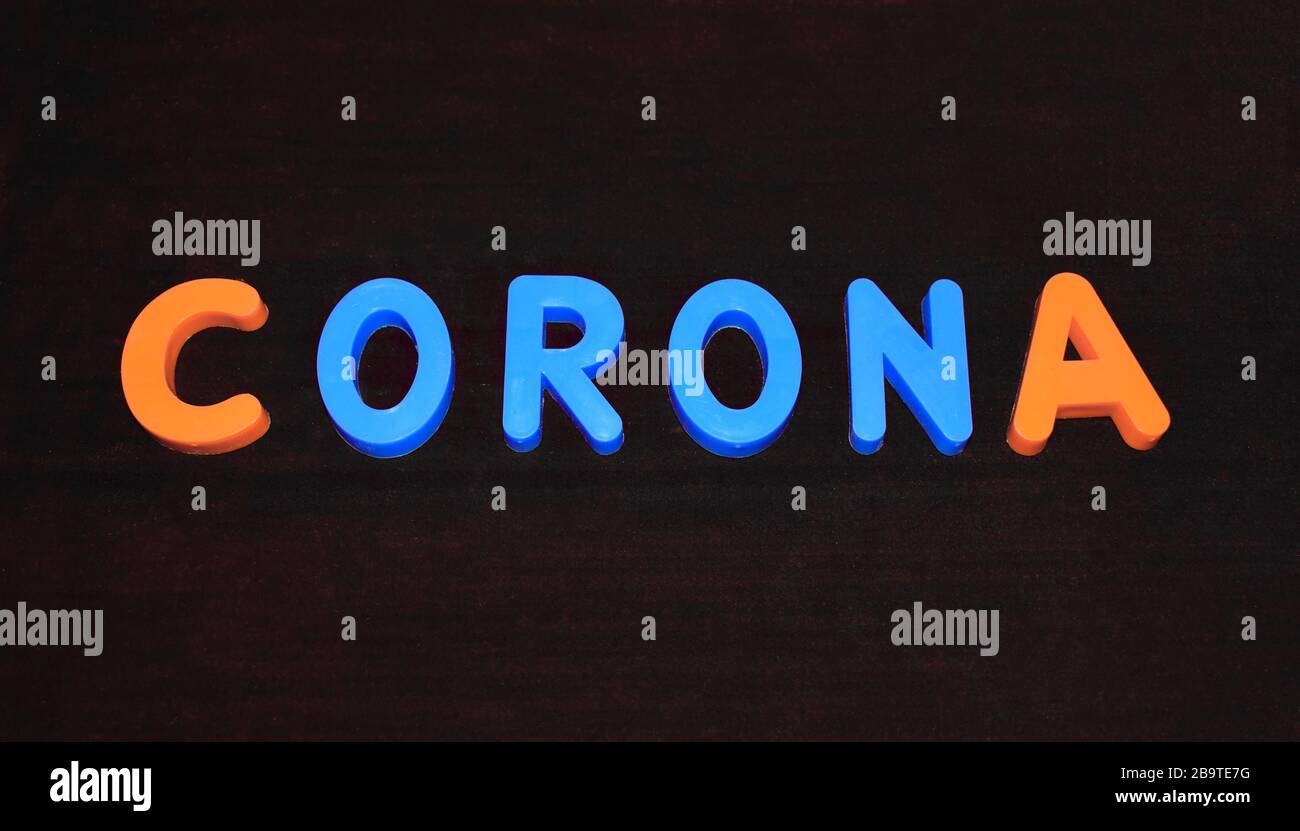 Corona word written with different colored letter blocks arranged on a ...
