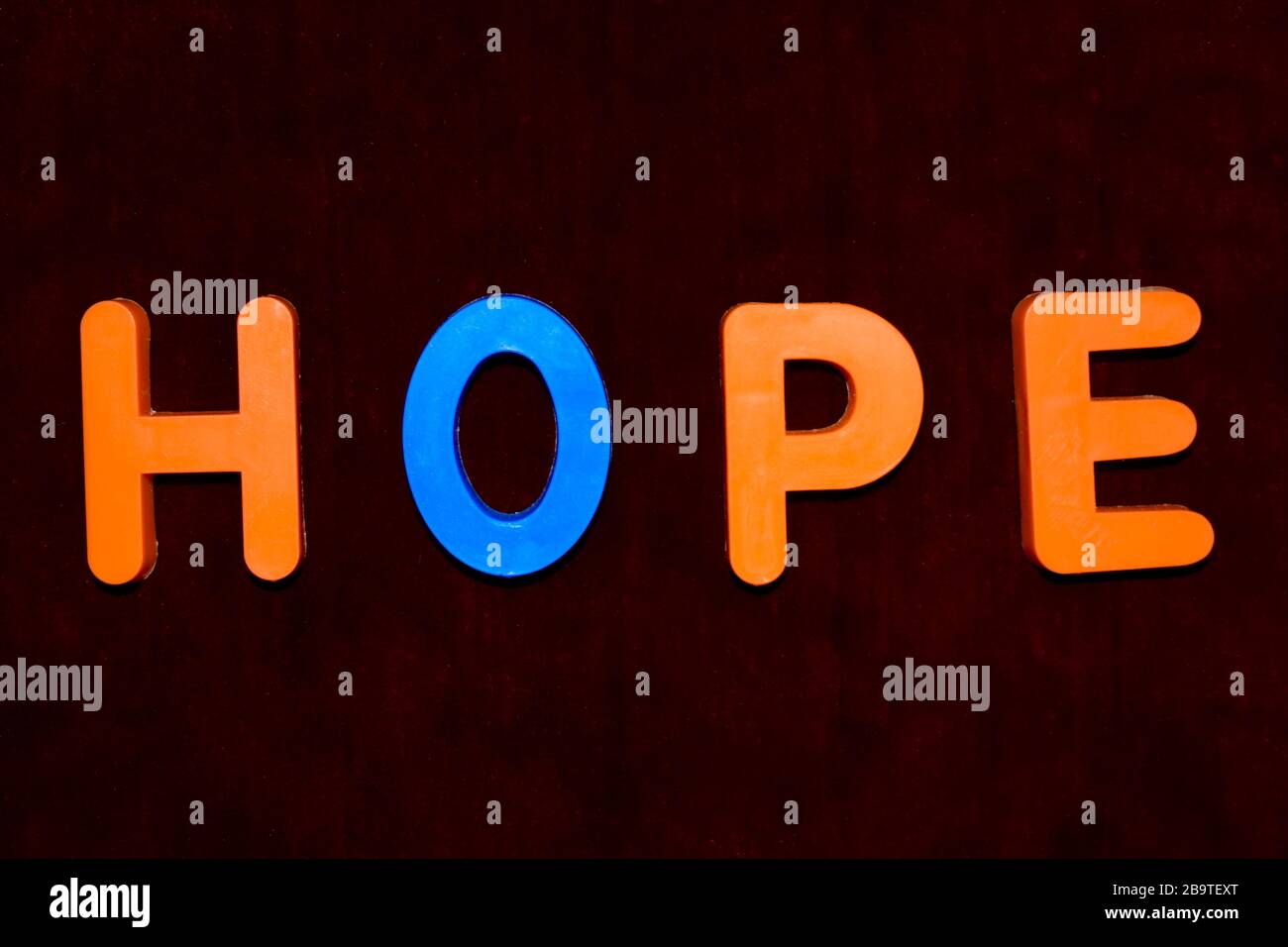 Hope word written with different colored letter blocks arranged on a ...