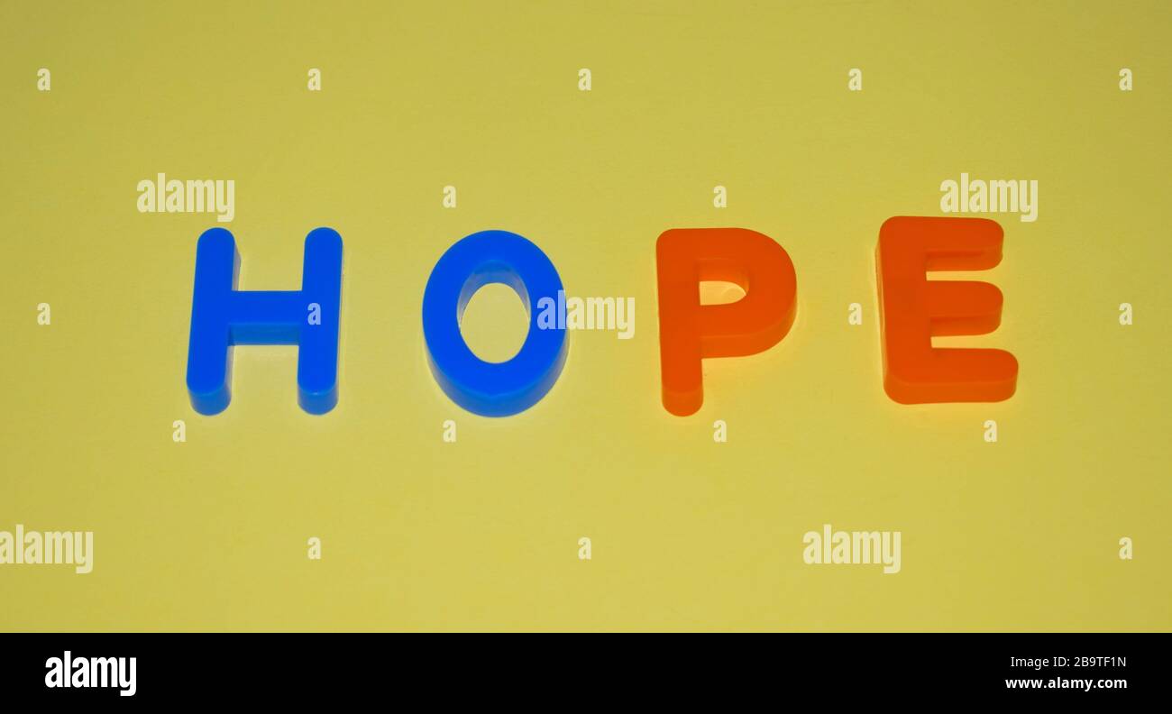 Hope word written with different colored letter blocks arranged on a ...