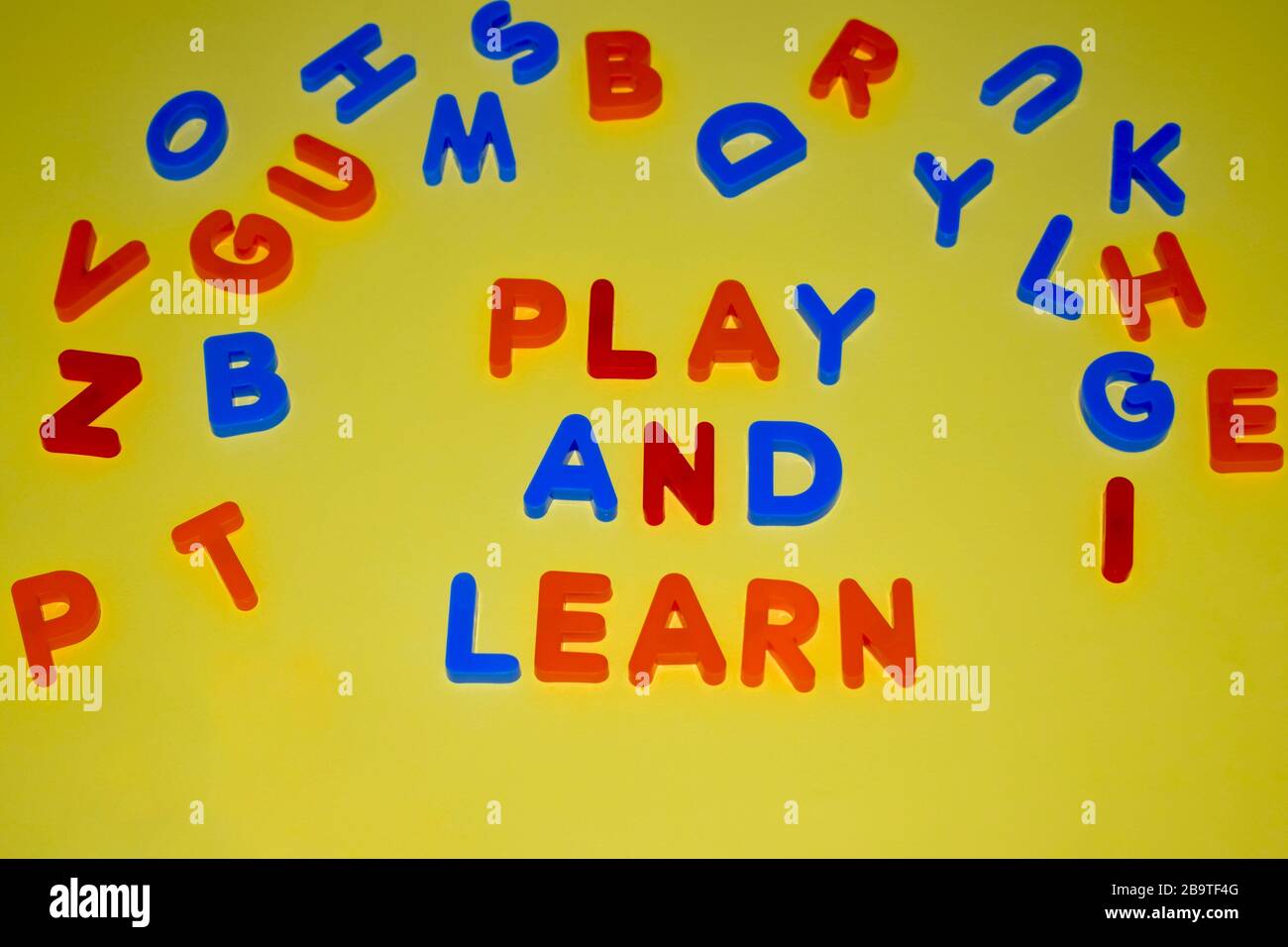 Play and learn words written with different colored letter blocks which ...