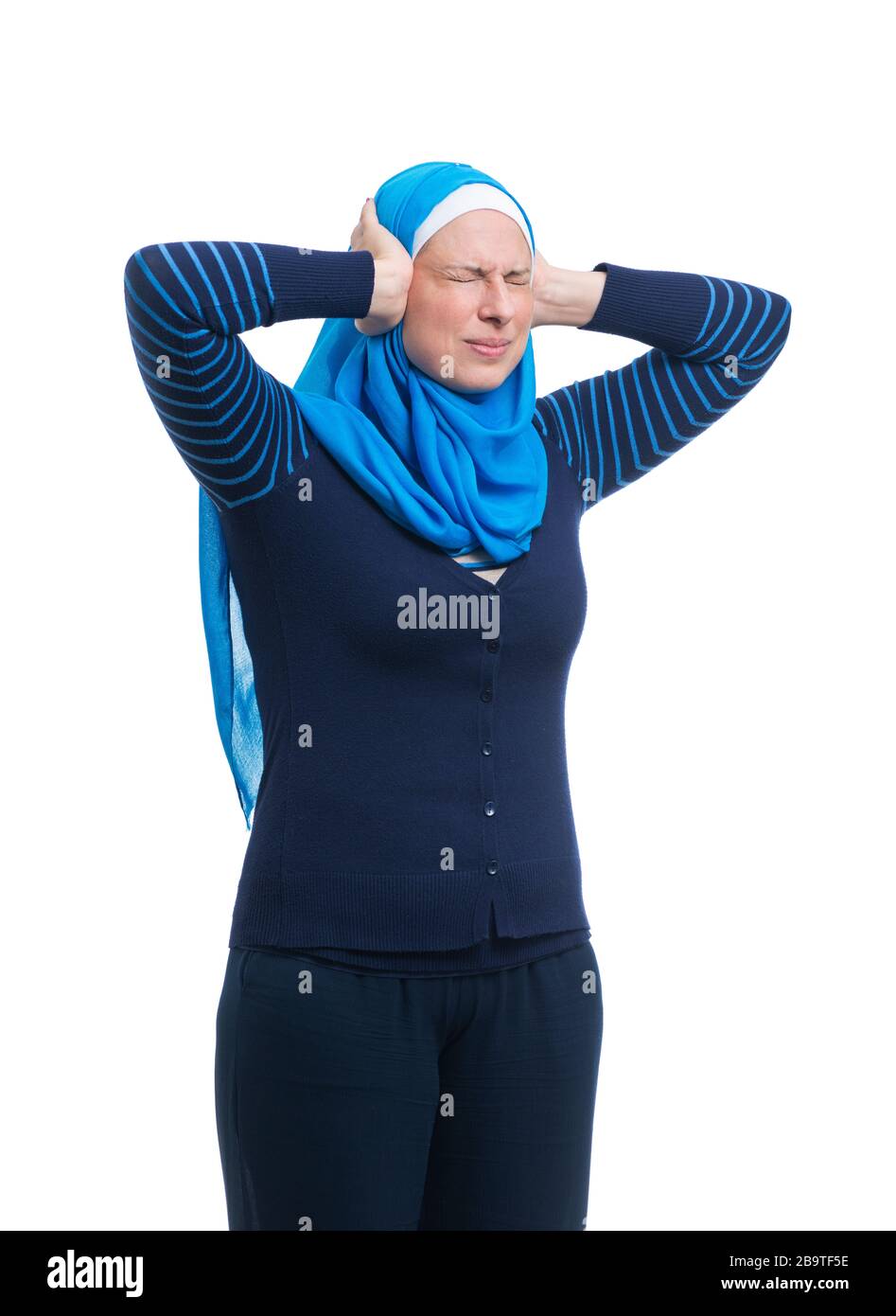 Angry woman covering ears with hands. Girl plugs his ears with his ...
