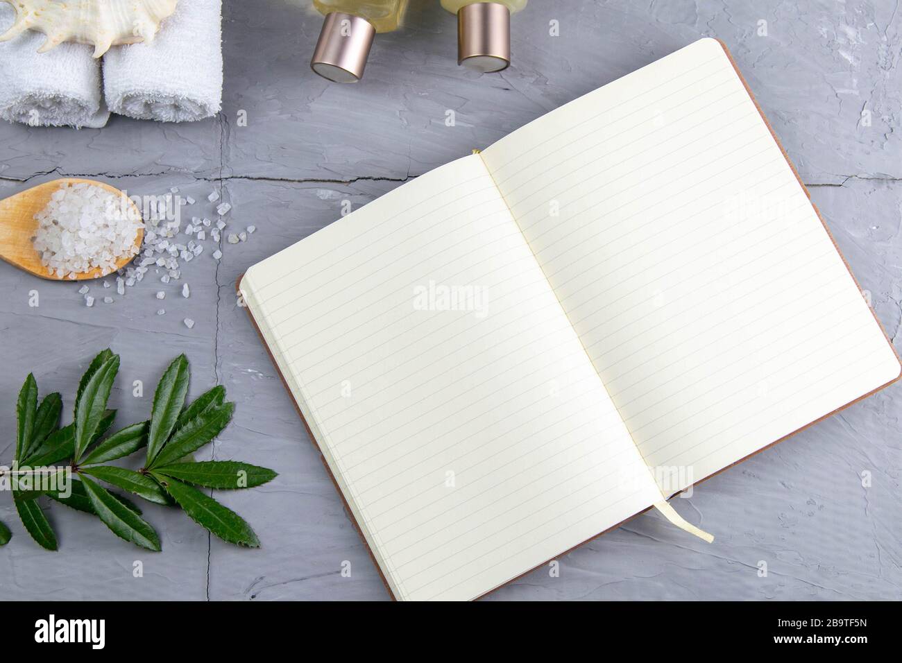 Spa with natural olive soap and sea salt and an open notebook for ...