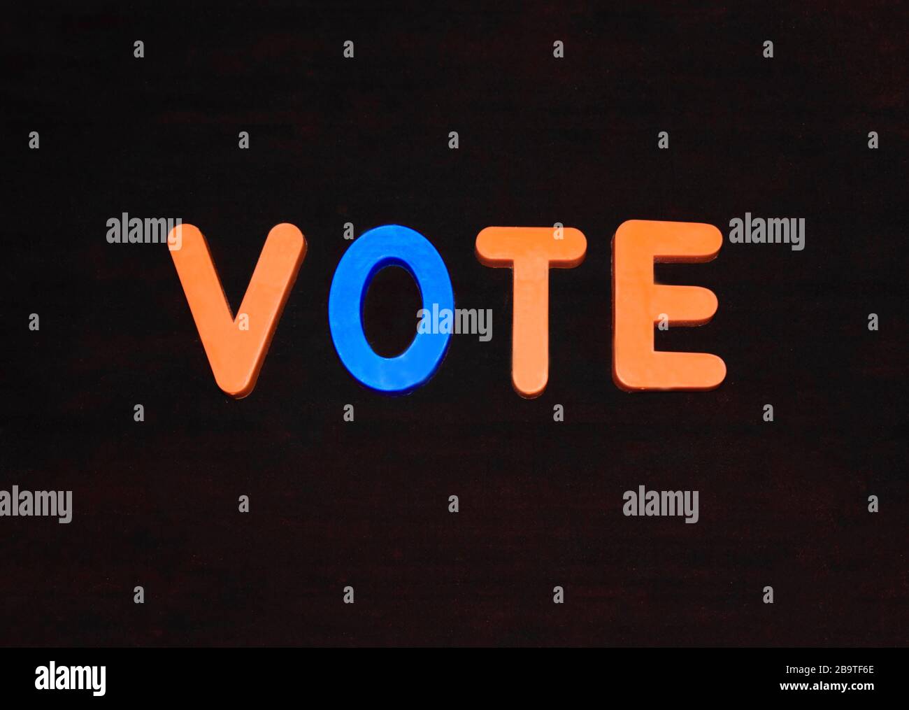 Vote word written with different colored letter blocks arranged on a ...