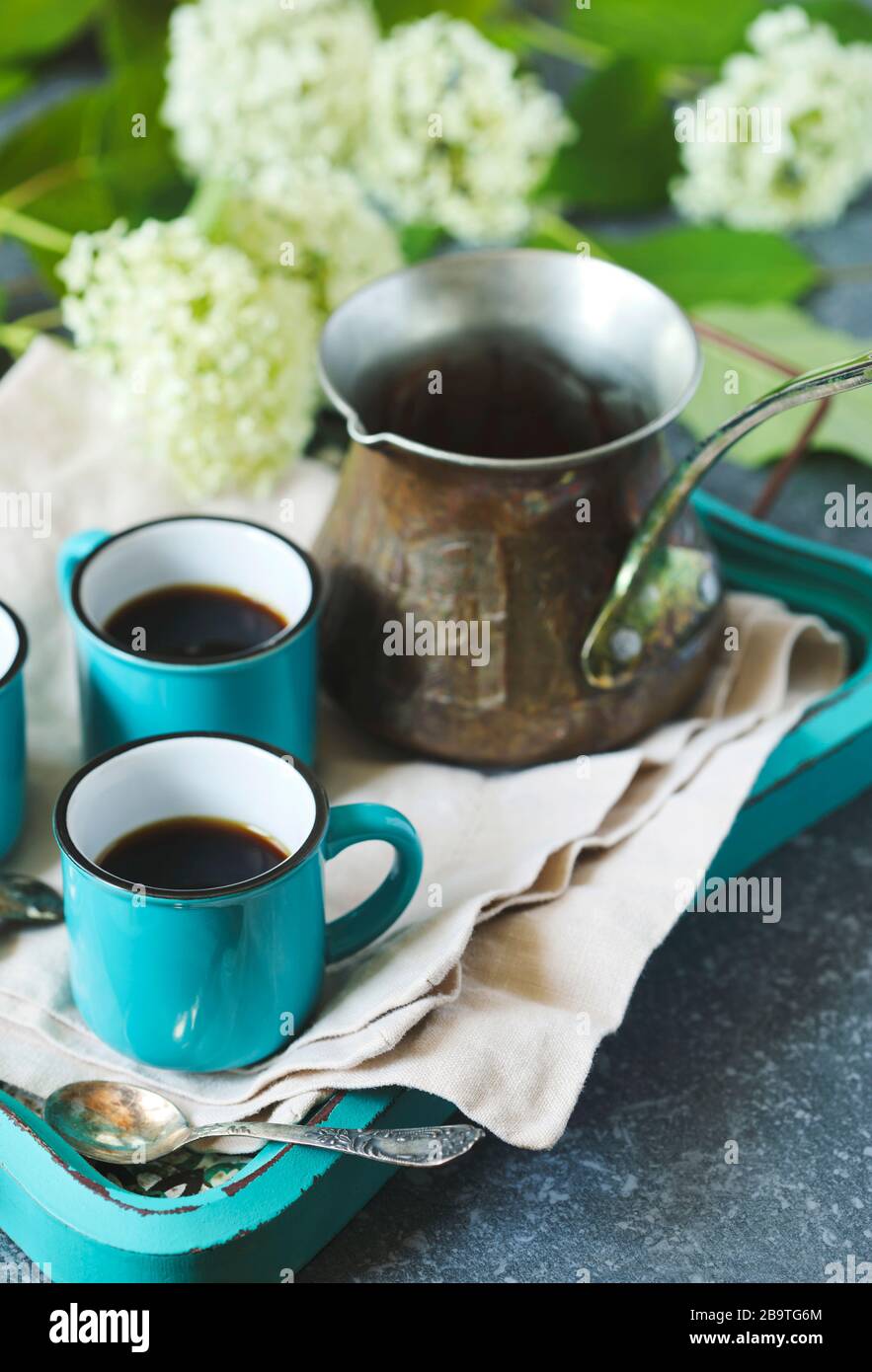 Cups of coffee and copper cerve on tray Stock Photo - Alamy