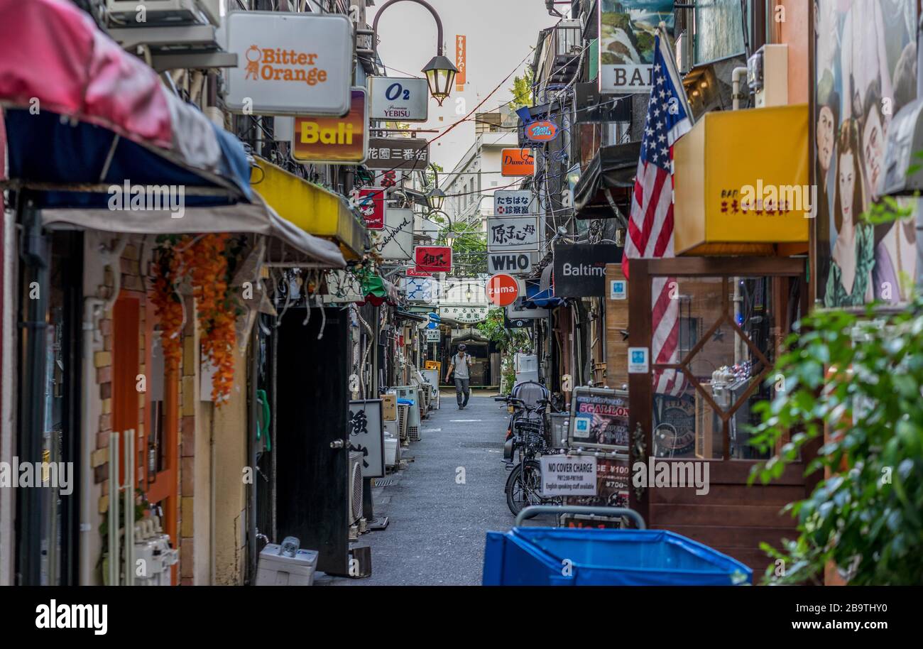 Small alley full of back street tiny bars in Golden Gai area during the ...