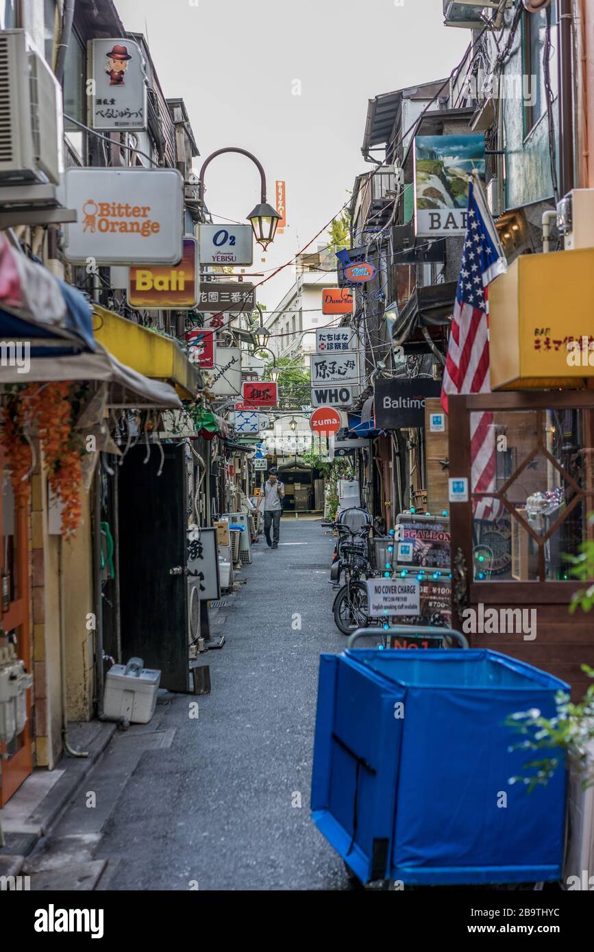 Small alley full of back street tiny bars in Golden Gai area during the ...