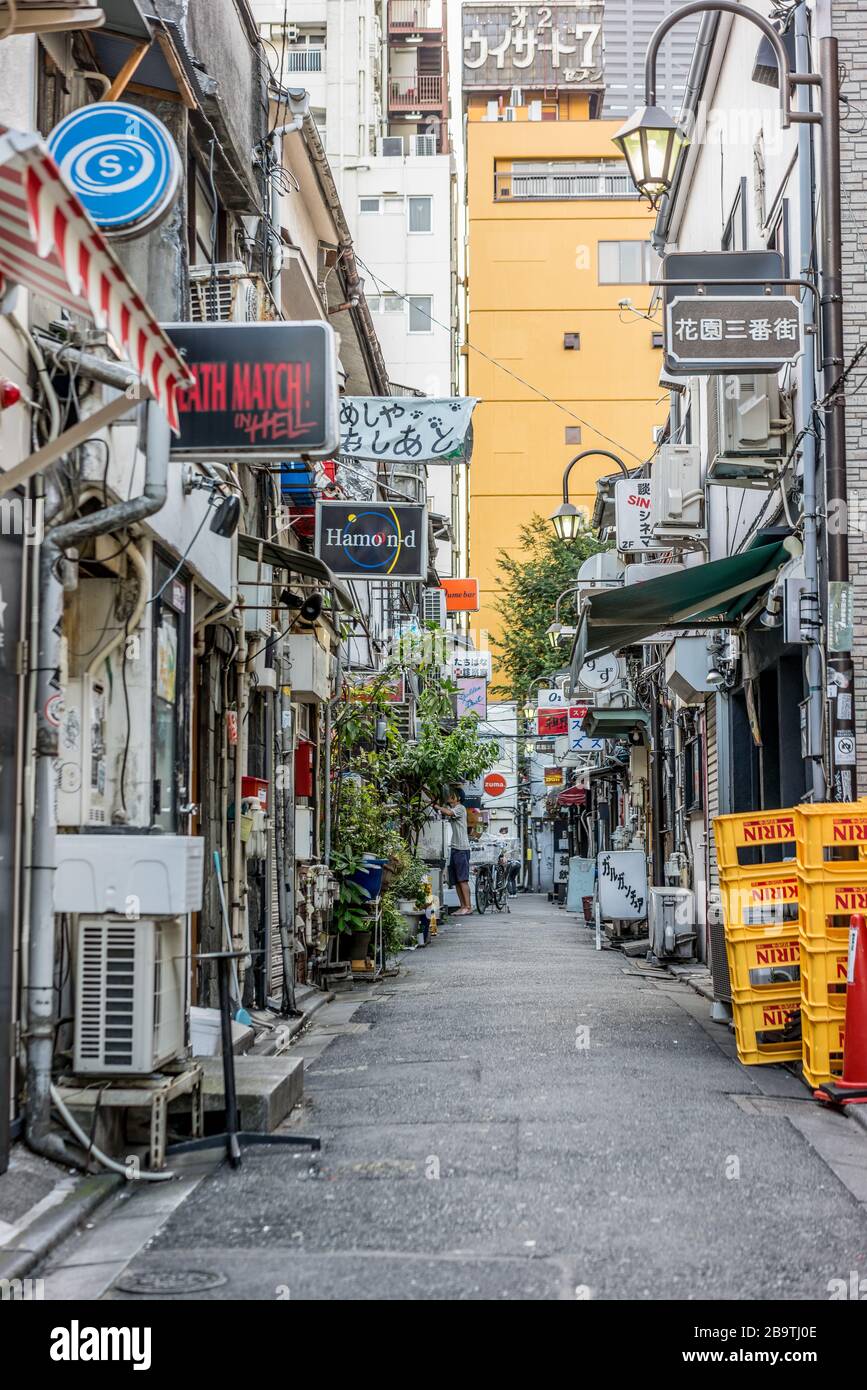 Small alley full of back street tiny bars in Golden Gai area during the ...