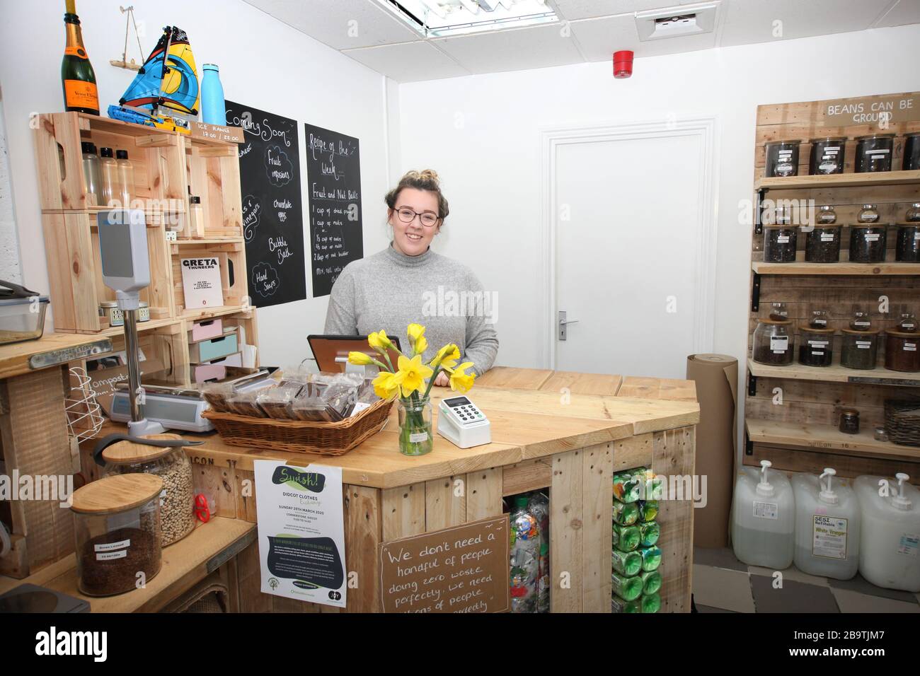 A shopkeeper in her zero waste store in the UK Stock Photo - Alamy
