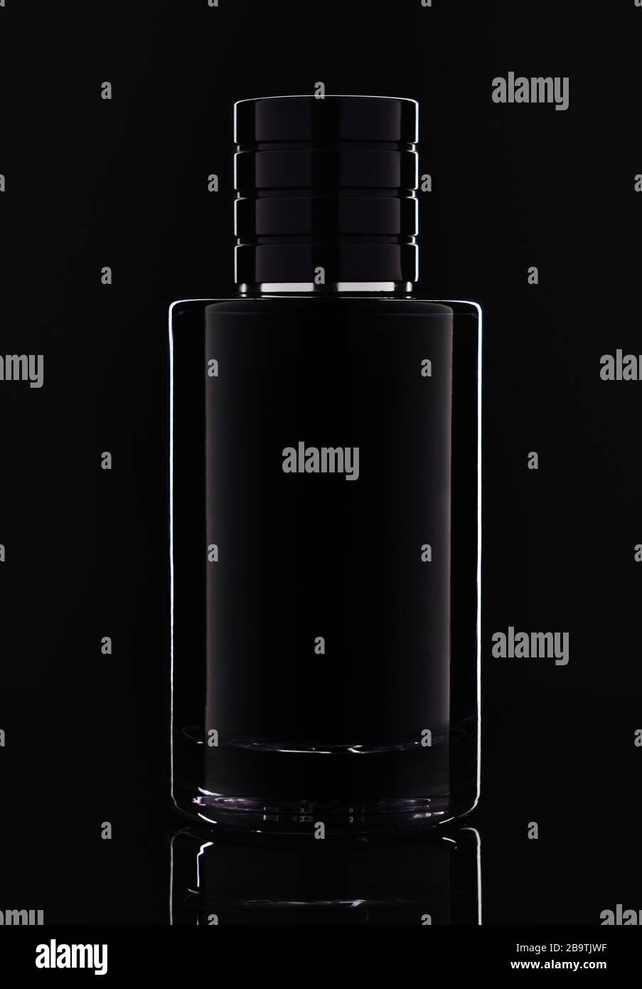 Studio shot of dark Glass perfume bottle on black background with with ...