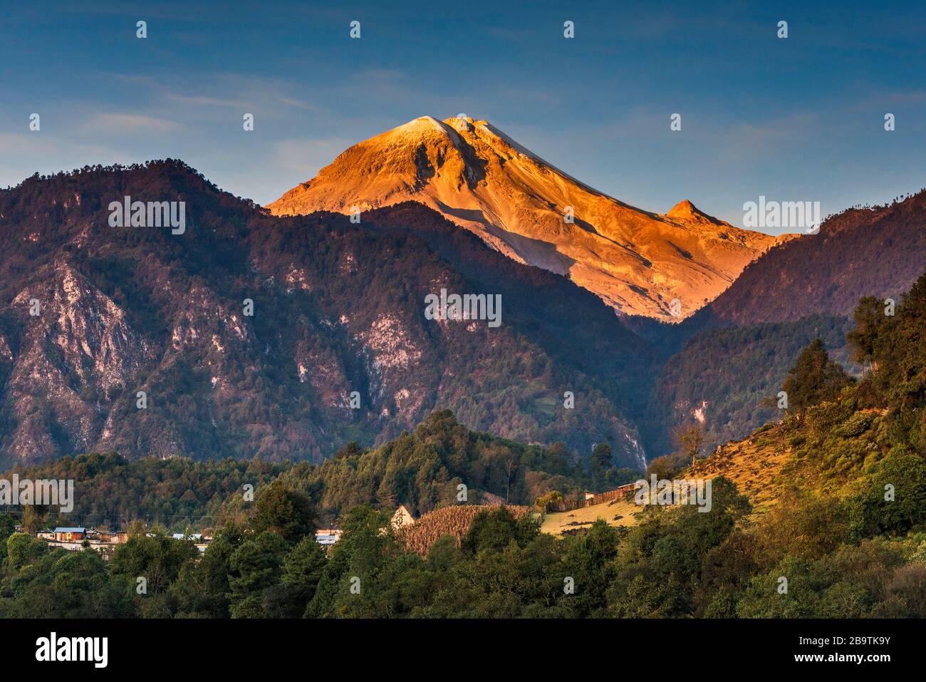 Pico de Orizaba, at sunrise, volcano, over village of Tetelzingo, near ...