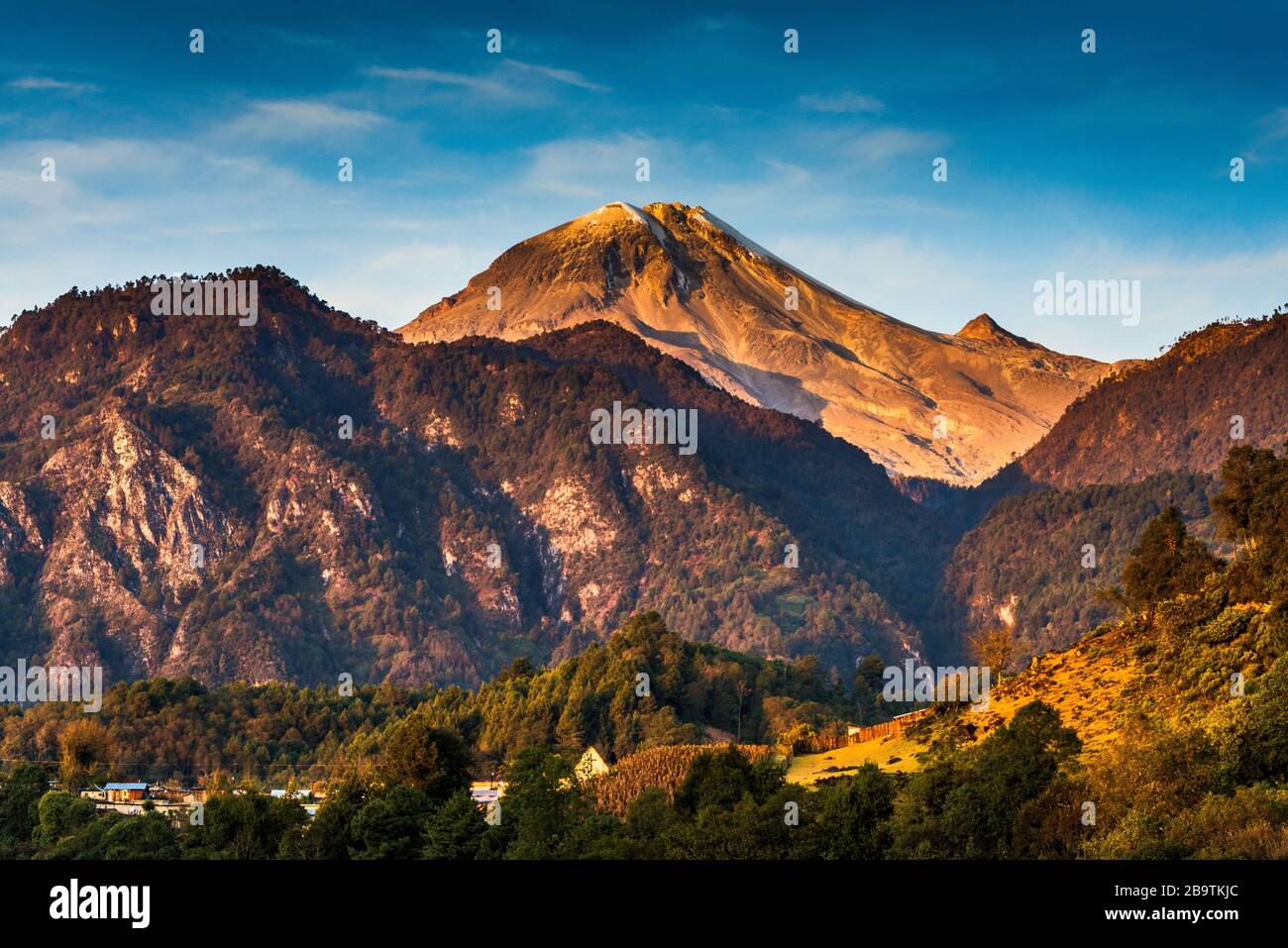 Pico de Orizaba, at sunrise, volcano, over village of Tetelzingo, near ...
