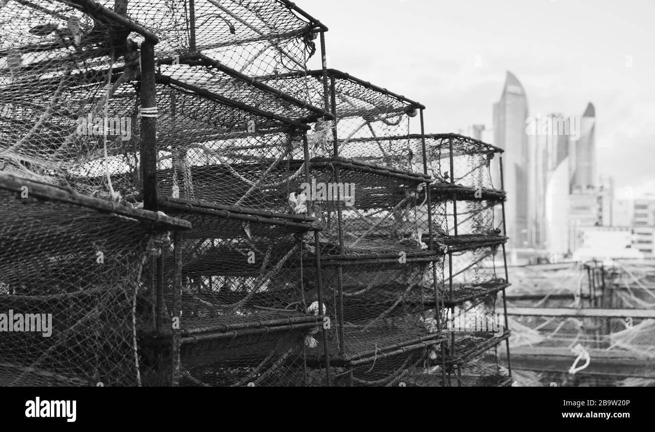 Traps for crabs lay in fishing port of Busan, South Korea. Black and ...