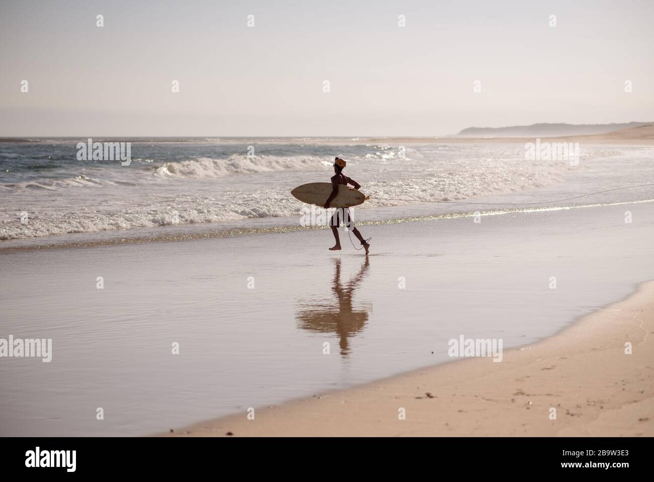 Man Running Into Waves High Resolution Stock Photography and Images - Alamy