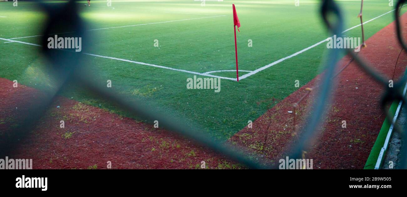 Soccer field with a corner red flag and flag pole Stock Photo - Alamy