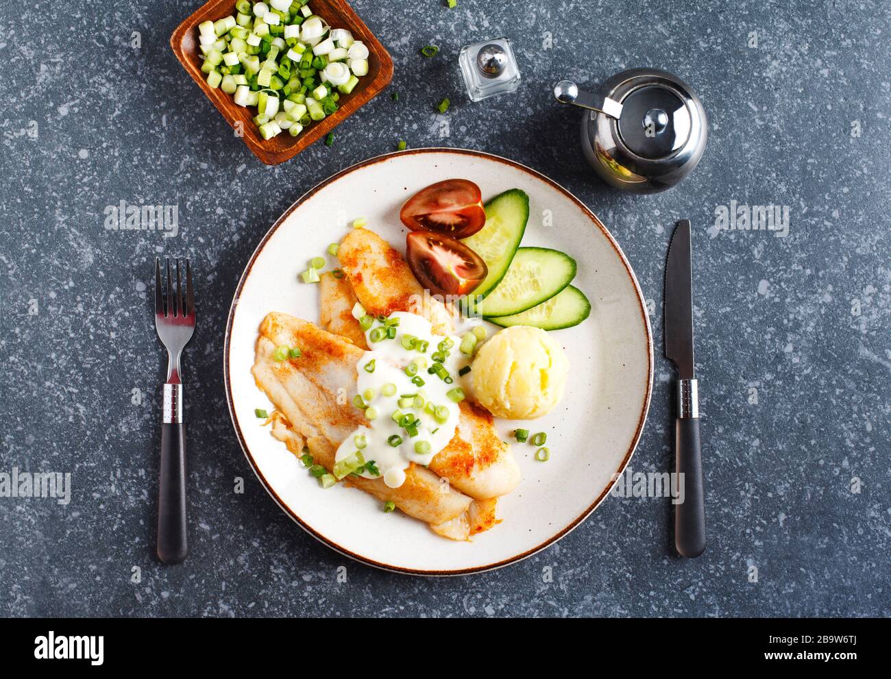 Fried Basa Fillet with sauce, mashed potato and fresh vegetables, top ...