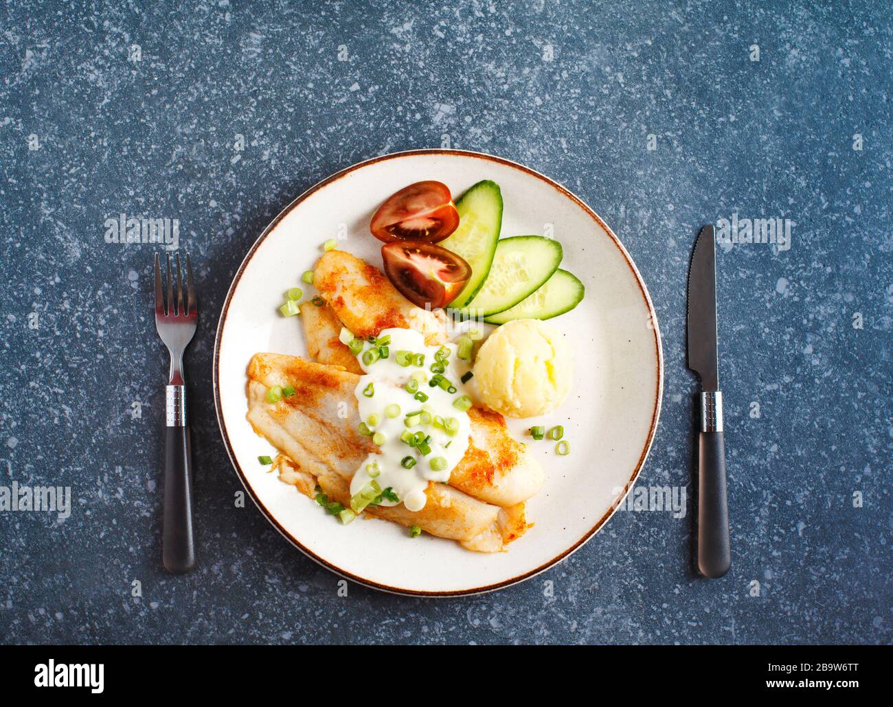 Fried Basa Fillet with sauce, mashed potato and fresh vegetables, top ...