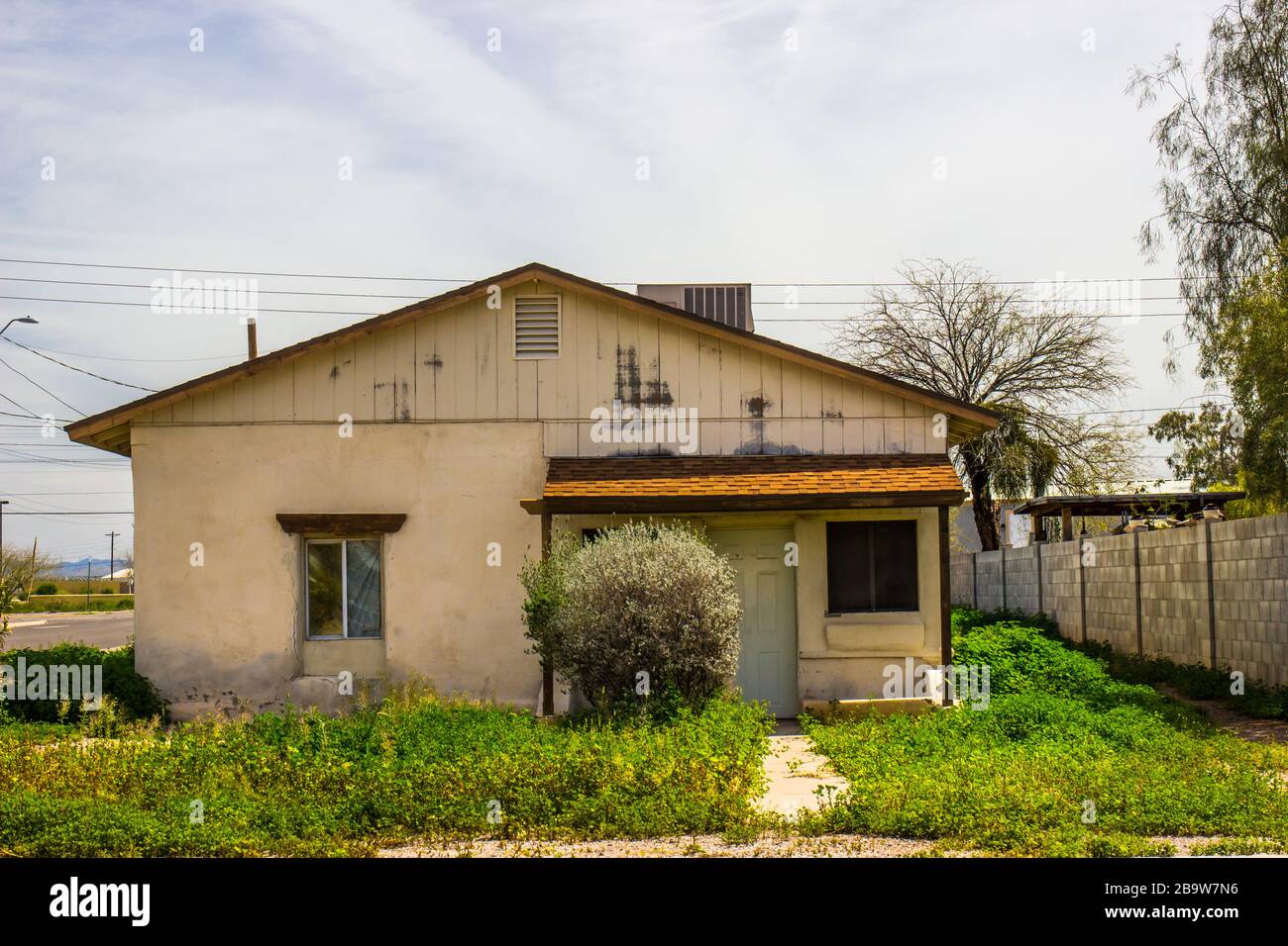 Abandoned One Story Home With Overgrown Yard Stock Photo - Alamy