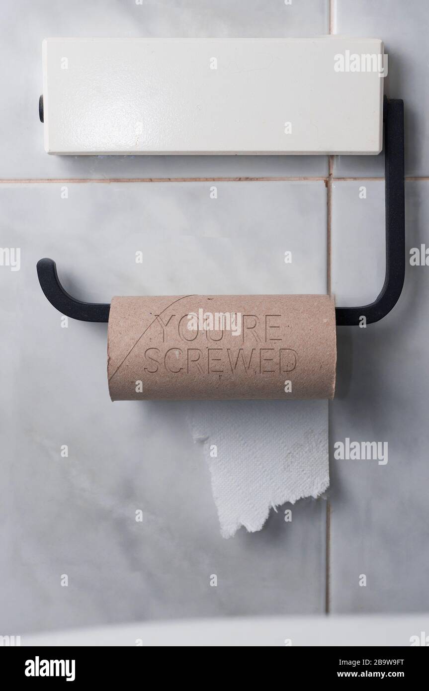 Finished roll of toilet paper with the inscription: you're screwed on a ...