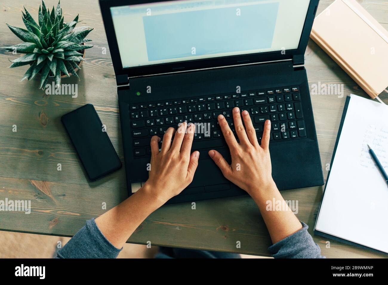 .hands on laptop keyboard Stock Photo - Alamy