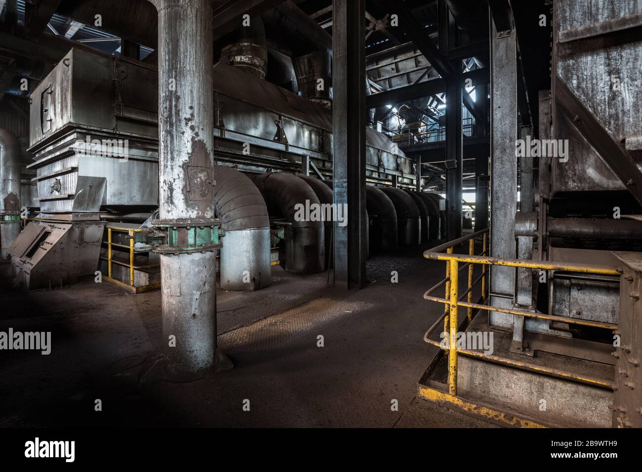 Interior of an old abandoned industrial steel factory Stock Photo - Alamy