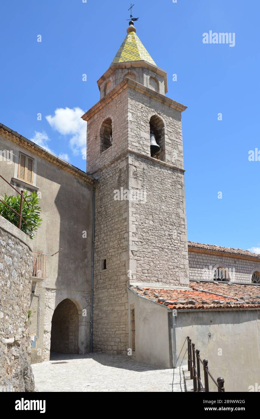 A narrow street between the old houses of Sepino, a medieval village in ...
